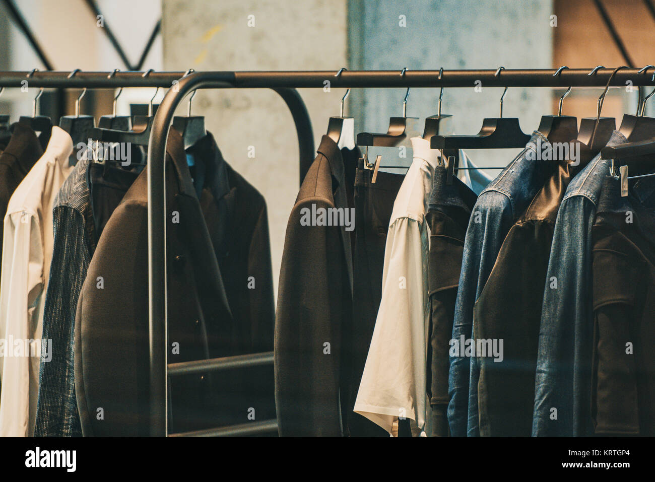 Men clothing on a rack - closeup photo Stock Photo - Alamy