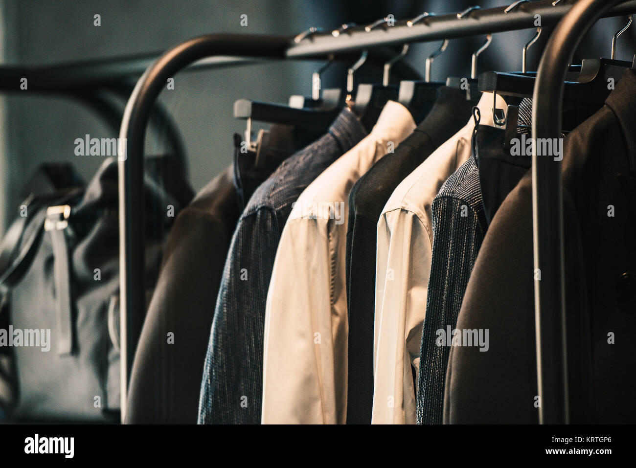 Men clothing on a rack - closeup photo Stock Photo - Alamy