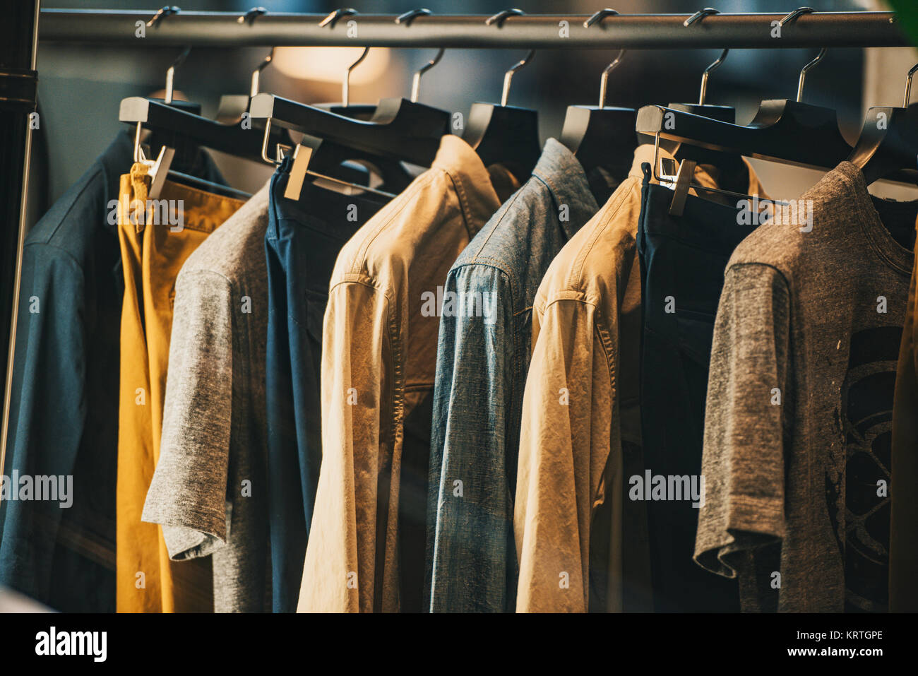 Men clothing on a rack - closeup photo Stock Photo - Alamy