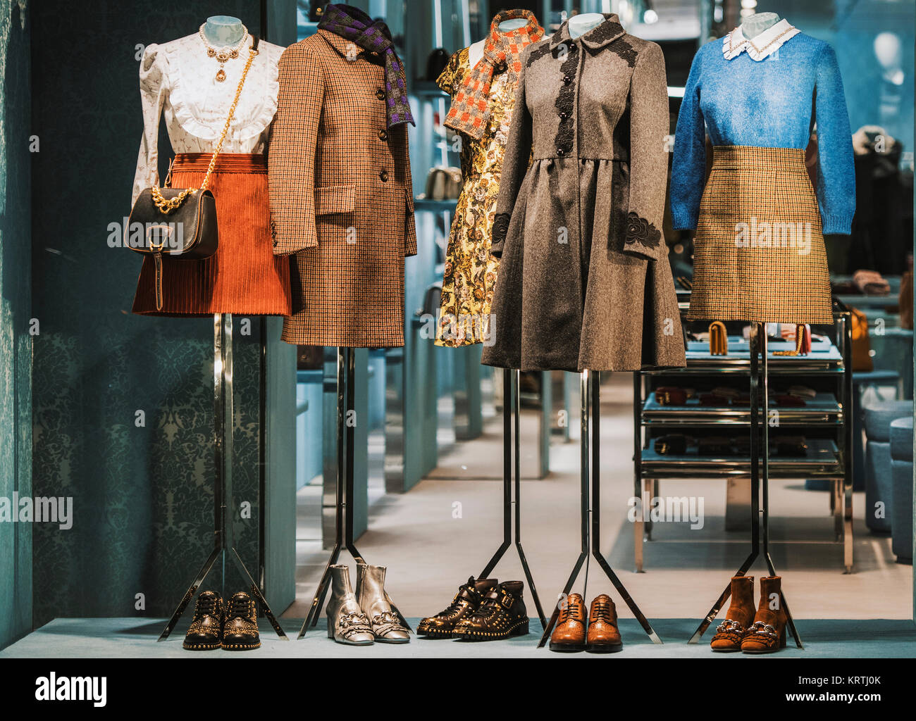 Beautiful clothing in a luxury store window Stock Photo - Alamy
