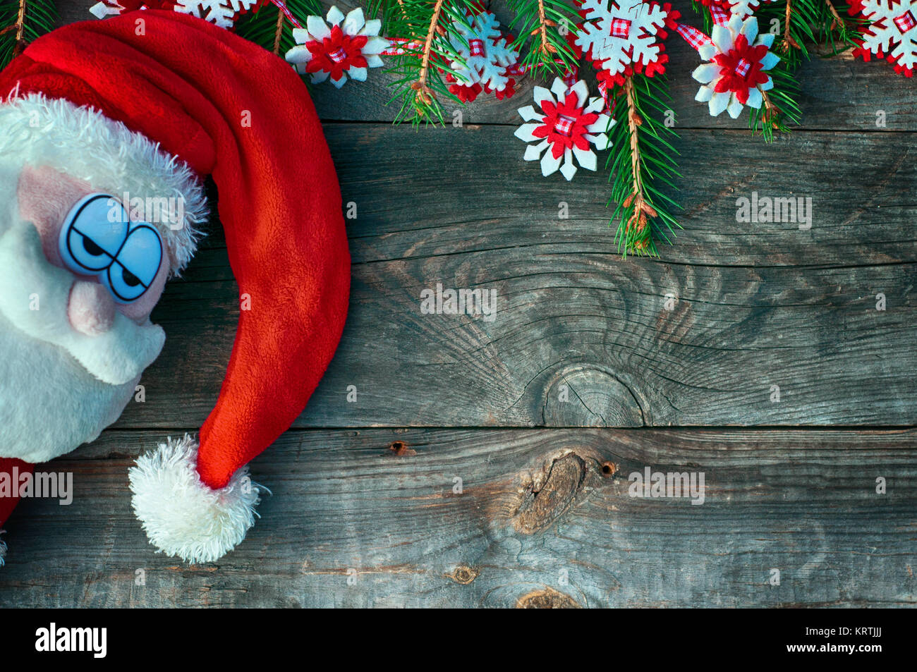 Santa claus sad face and fir branches decorated Stock Photo - Alamy