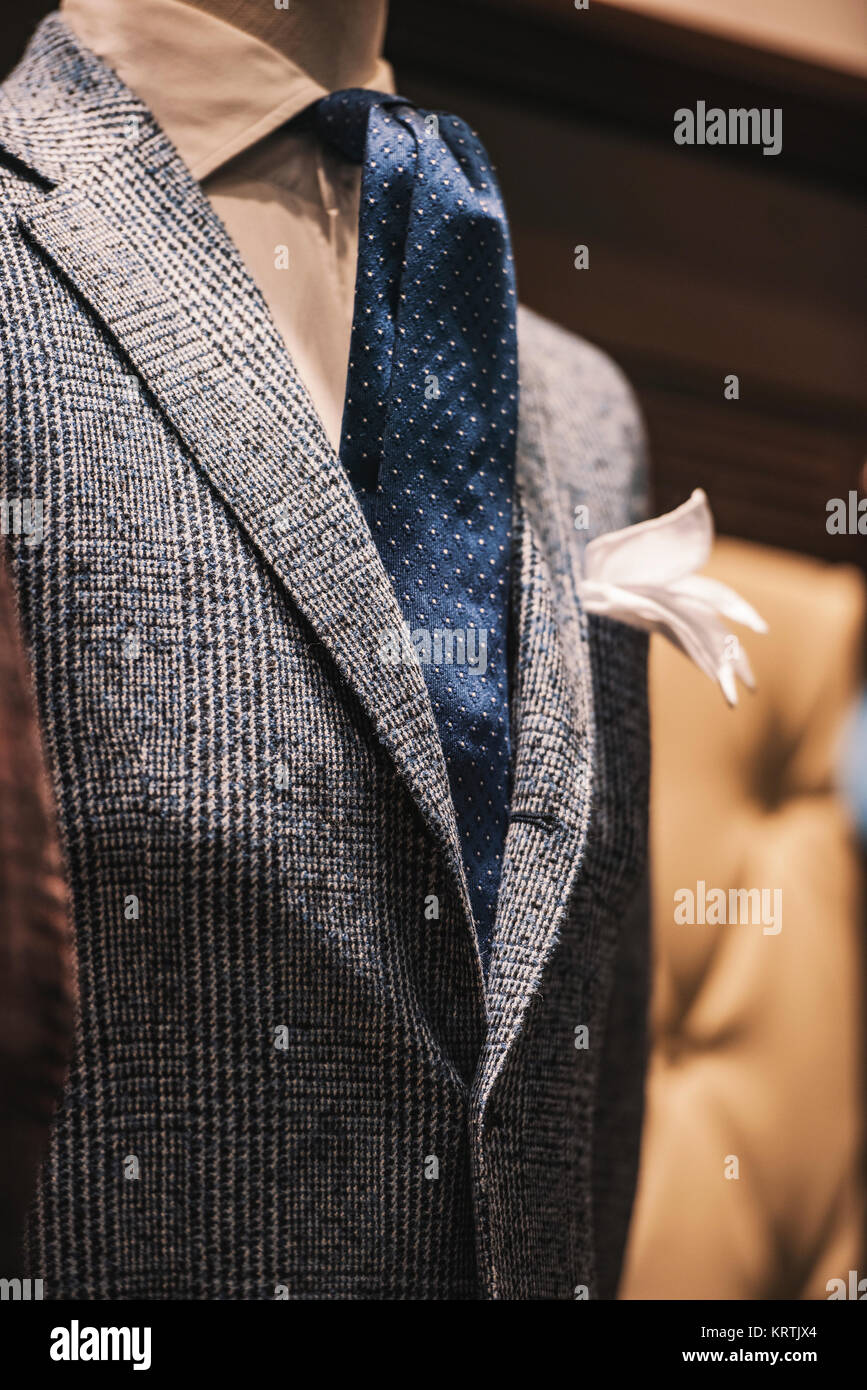 Men suit in a store window Stock Photo - Alamy