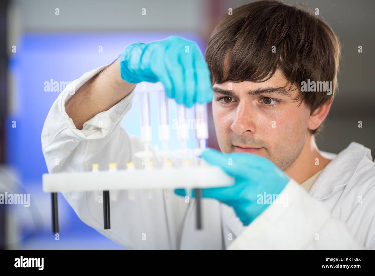 Young male researcher carrying out scientific research in a lab ...