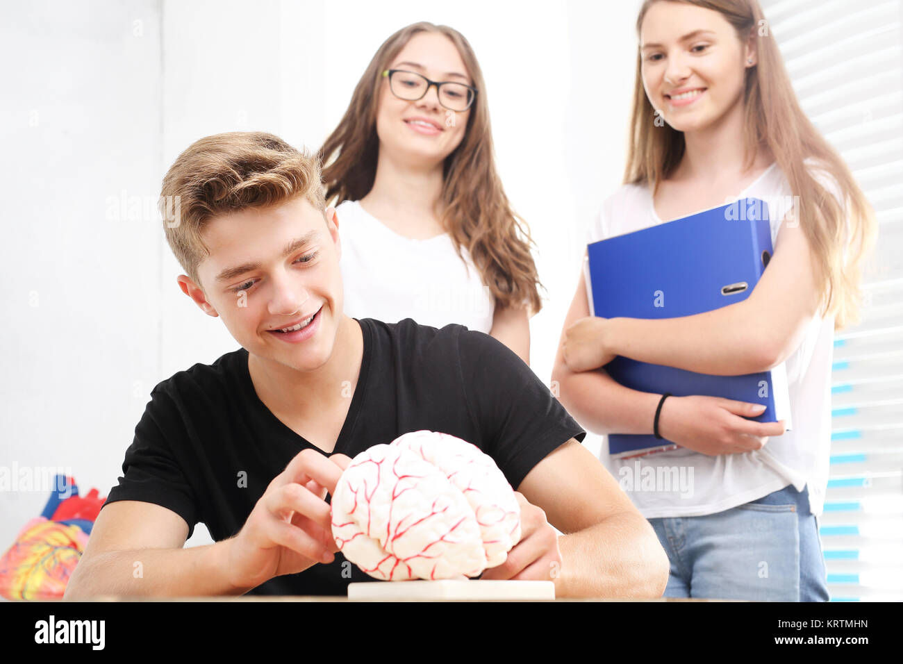 teenagers on the biology lesson Stock Photo - Alamy