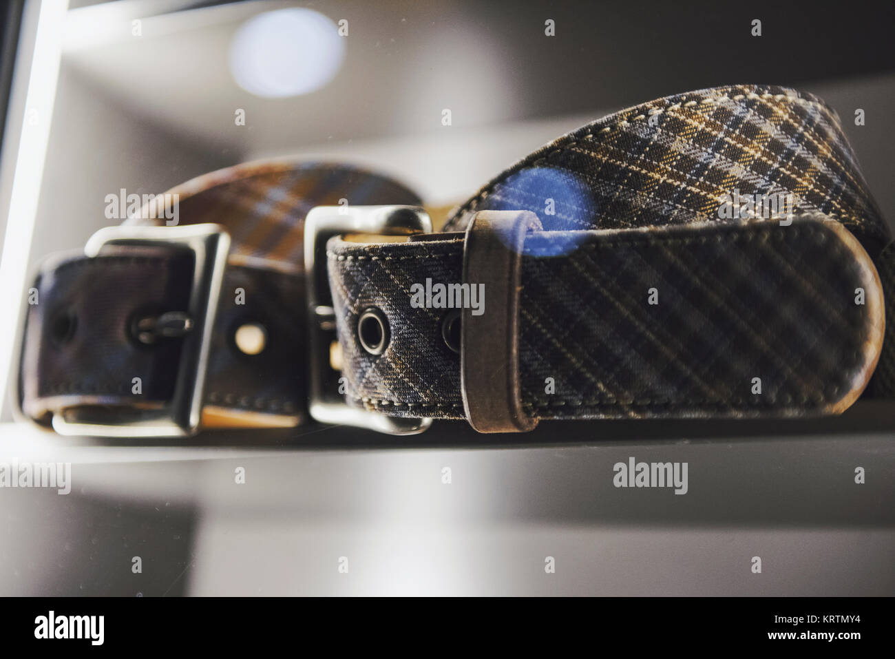 Belt in a showcase Stock Photo - Alamy