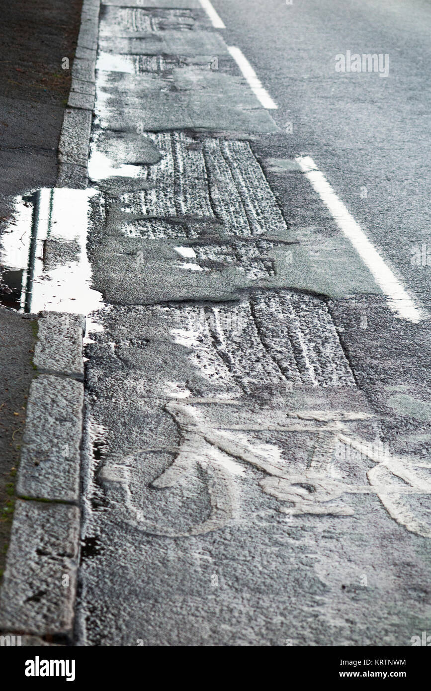 Poor quality broken bicycle / bike / cycle lane / lanes with cracked ...