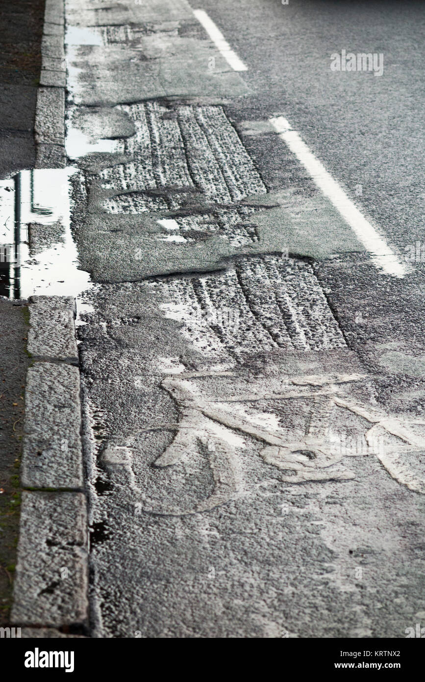 Poor quality broken bicycle / bike / cycle lane / lanes with cracked ...