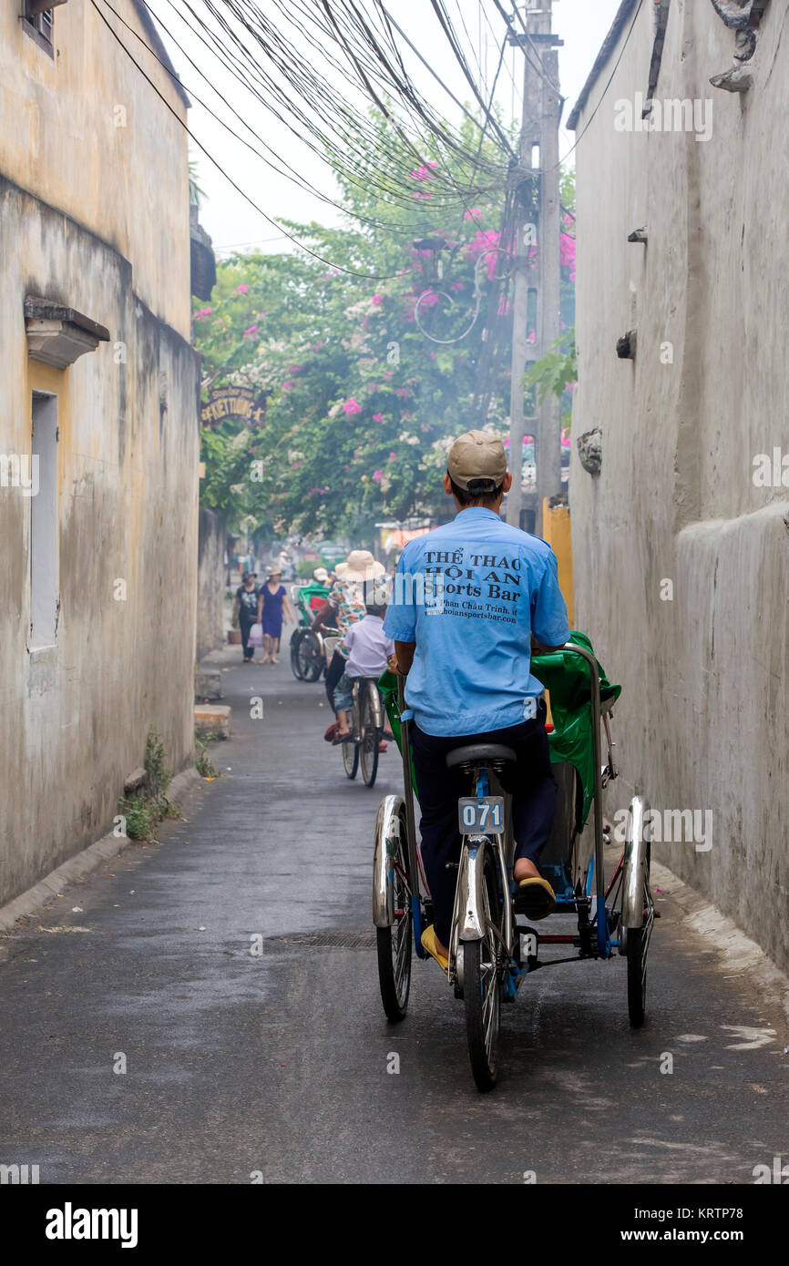 Royalty high quality free stock image of cyclo driver cycling on a ...