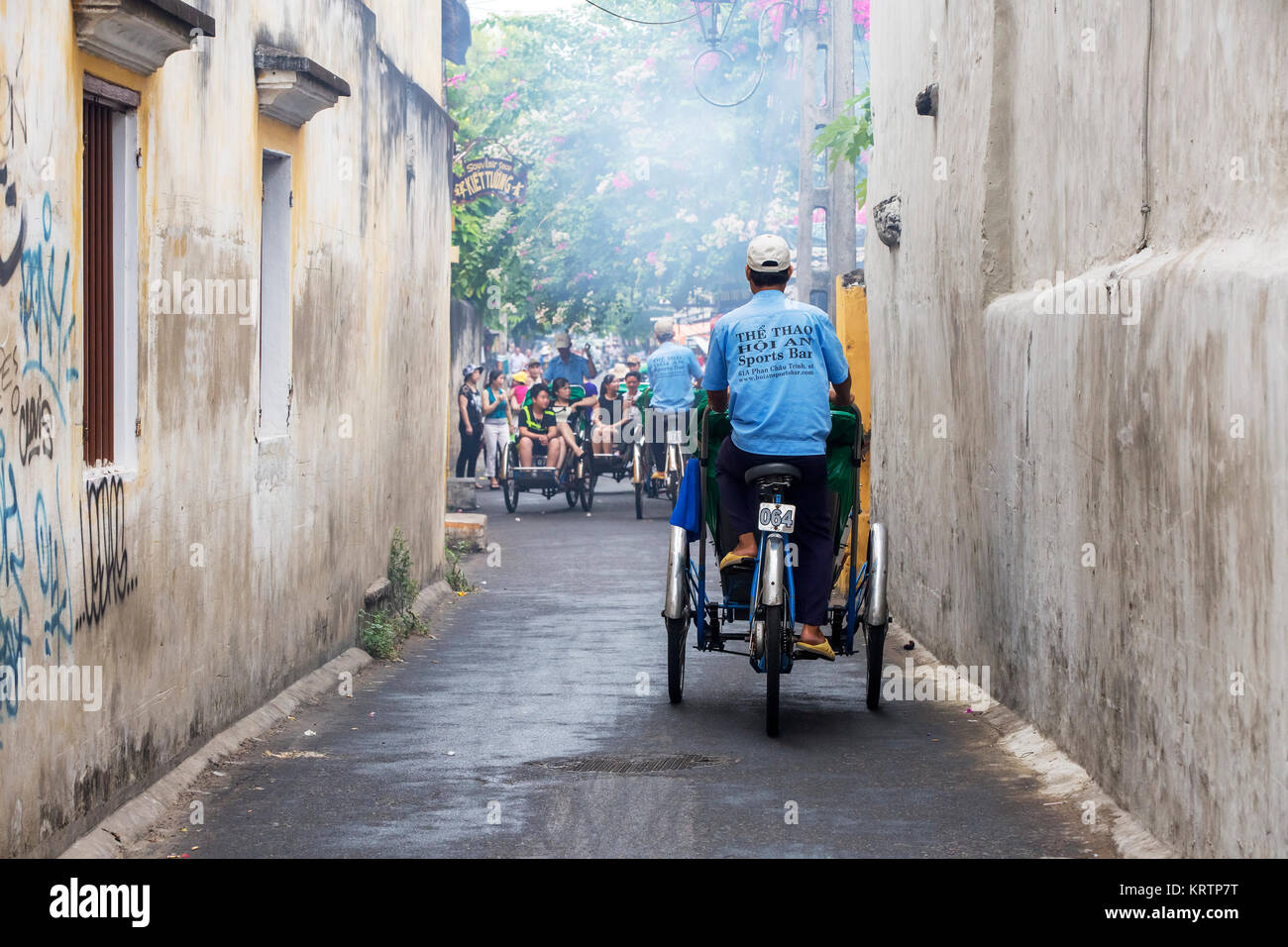 Royalty high quality free stock image of cyclo driver cycling on a ...