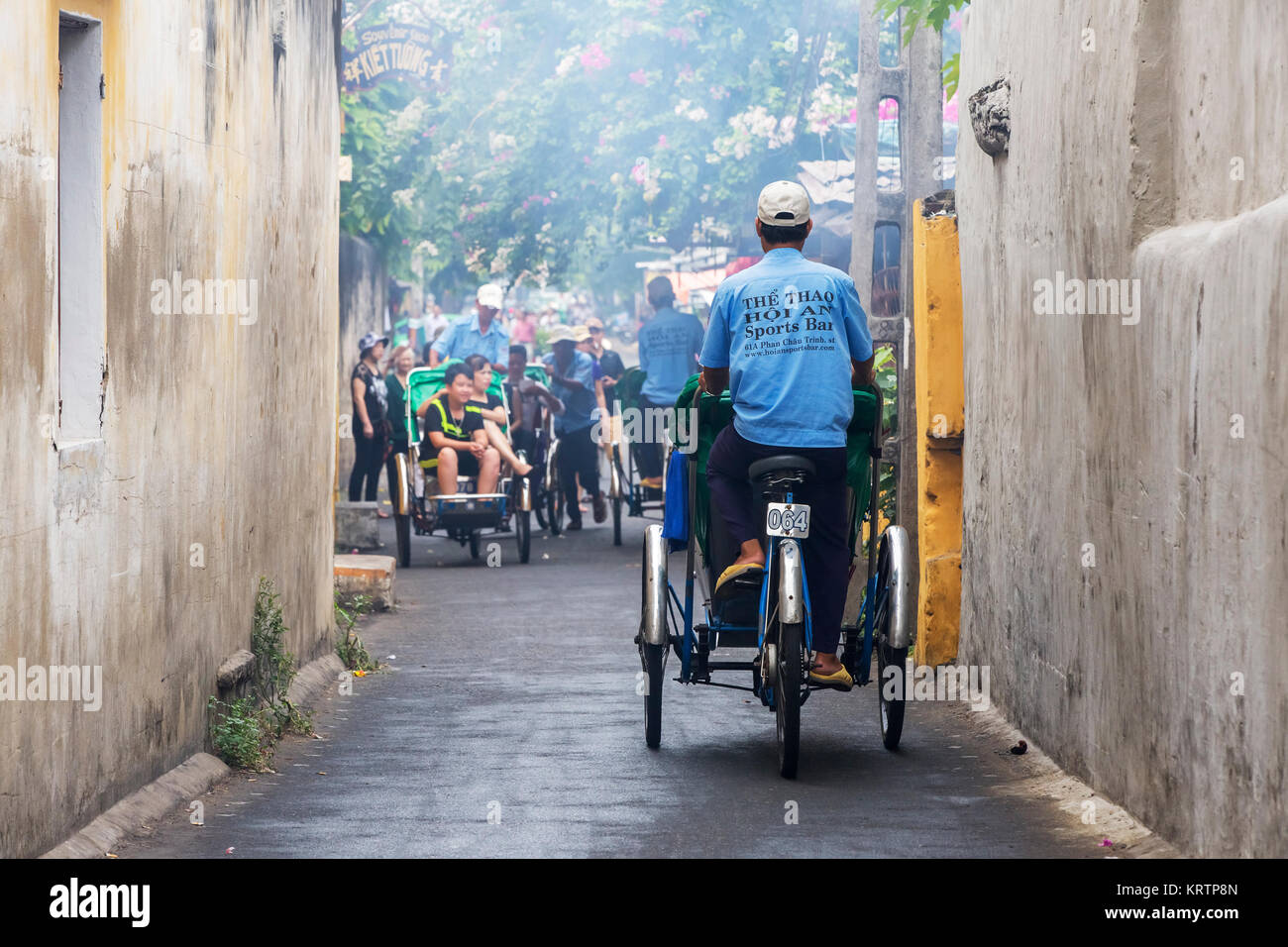 Royalty high quality free stock image of cyclo driver cycling on a ...