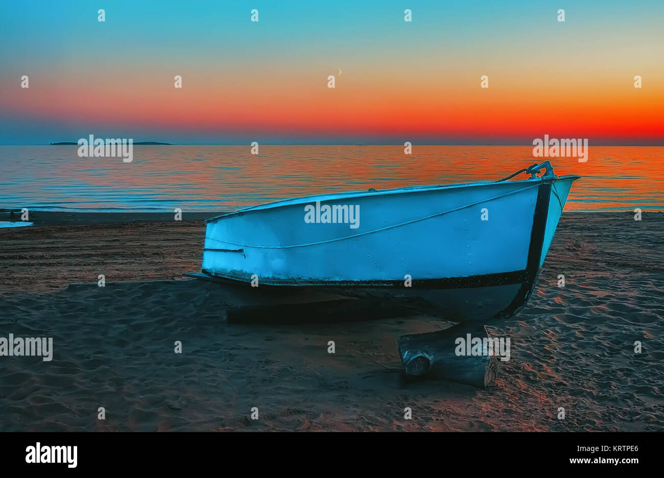 Blue Boat On The Beach At Sunset Stock Photo - Alamy