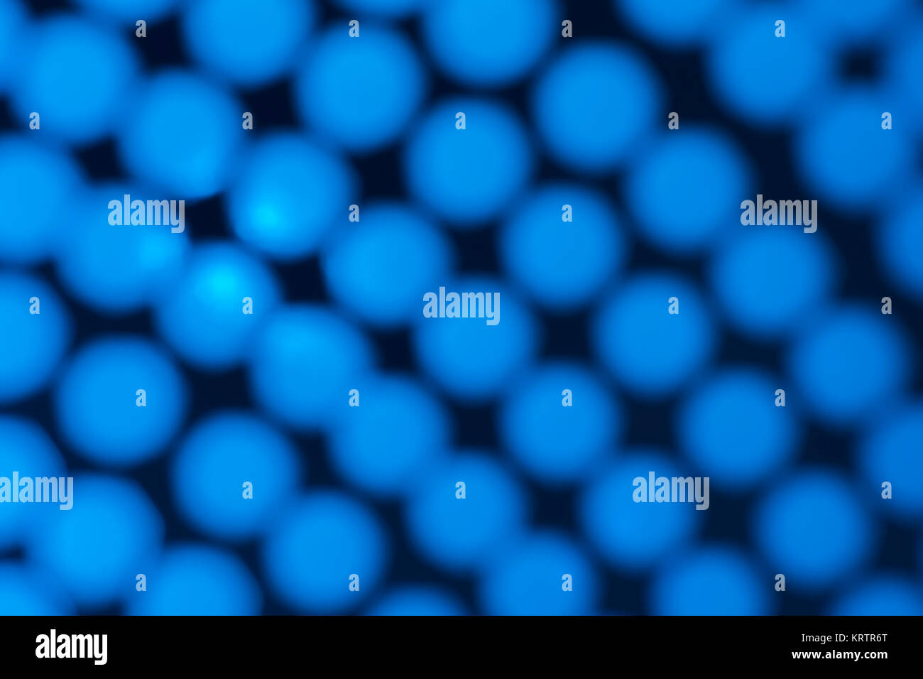 Abstract blurred blue dots pattern as photographic backdrop or ...
