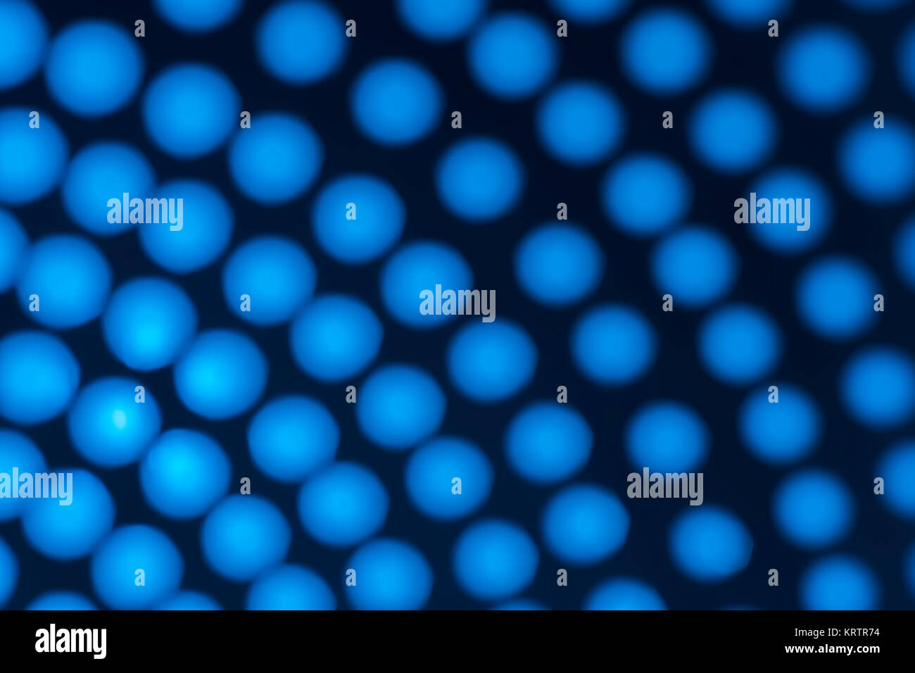 Abstract blurred blue dots pattern as photographic backdrop or ...