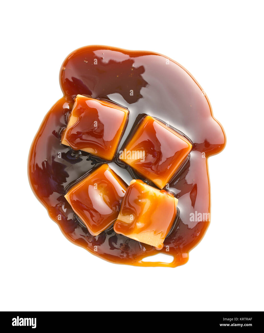 Caramel candies with caramel sauce Stock Photo - Alamy