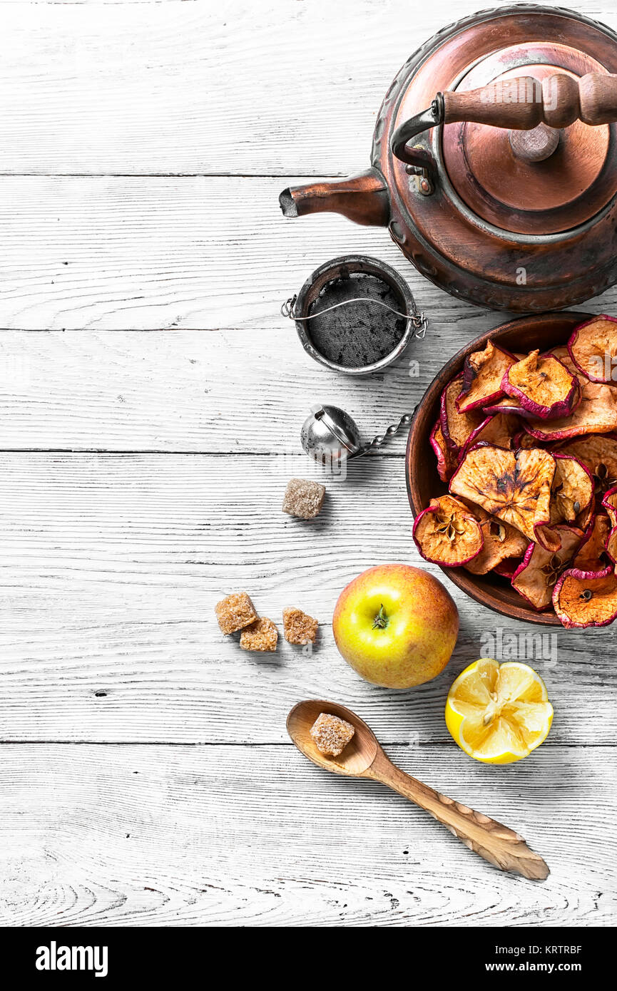 kettle with herbal tea treatment with dry apples Stock Photo - Alamy