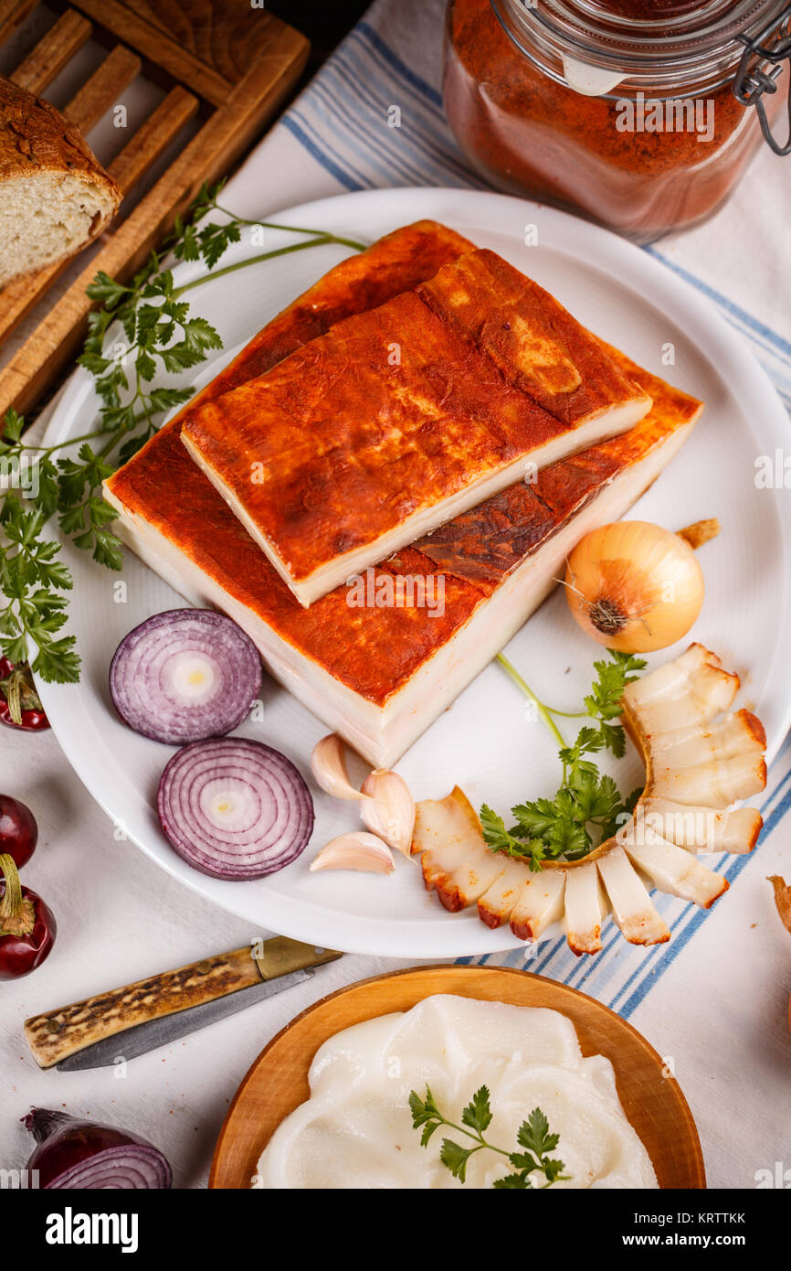 Whole and slice fat bacon Stock Photo - Alamy