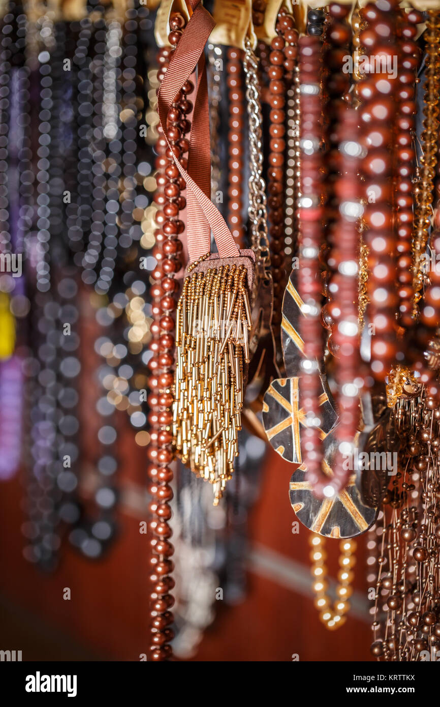 Different colored trinkets Stock Photo - Alamy