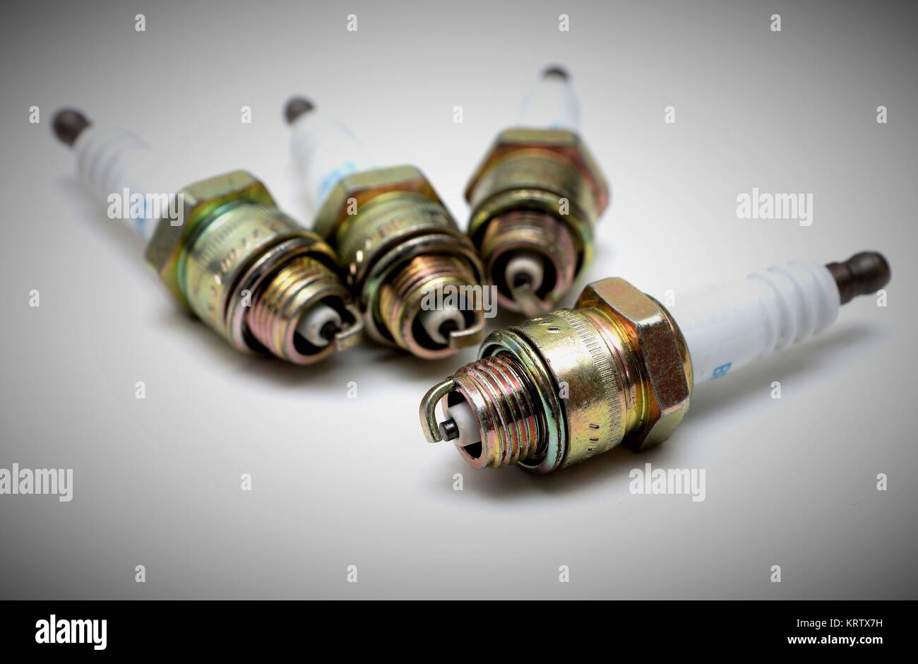 spark plugs on white background Stock Photo - Alamy