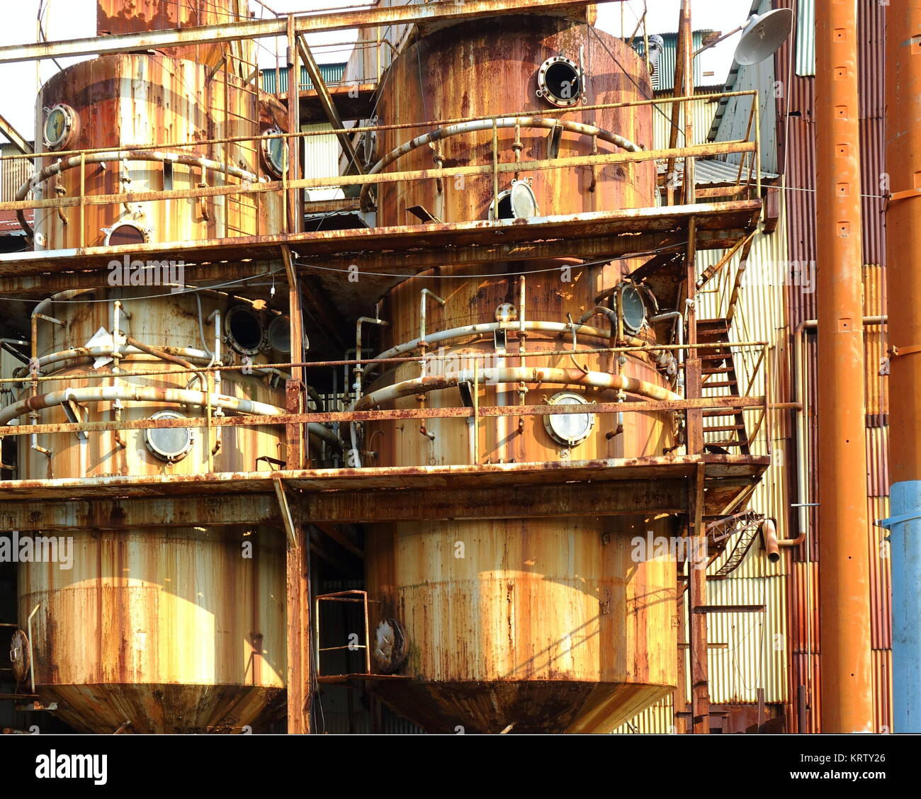 Large rusting storage tanks at a vintage industrial facility Stock ...
