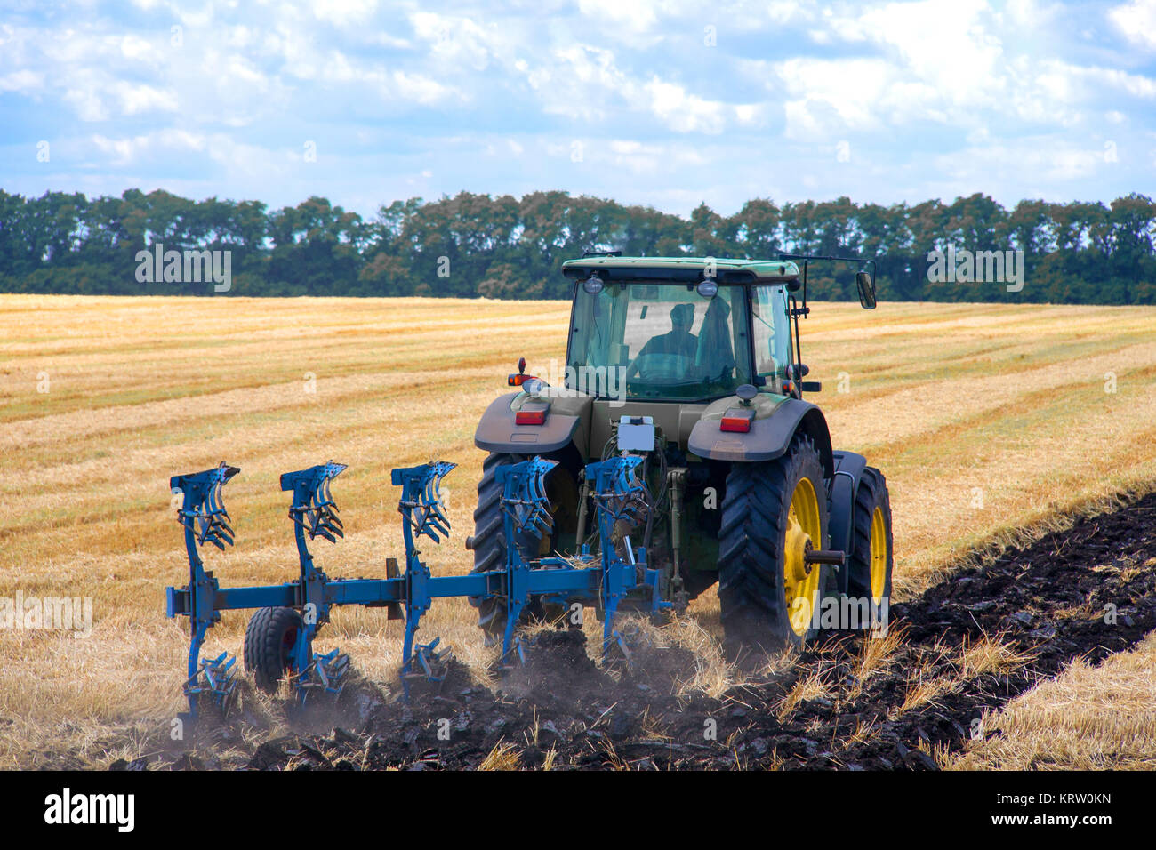 Tractor preparing land for sowing Stock Photo - Alamy