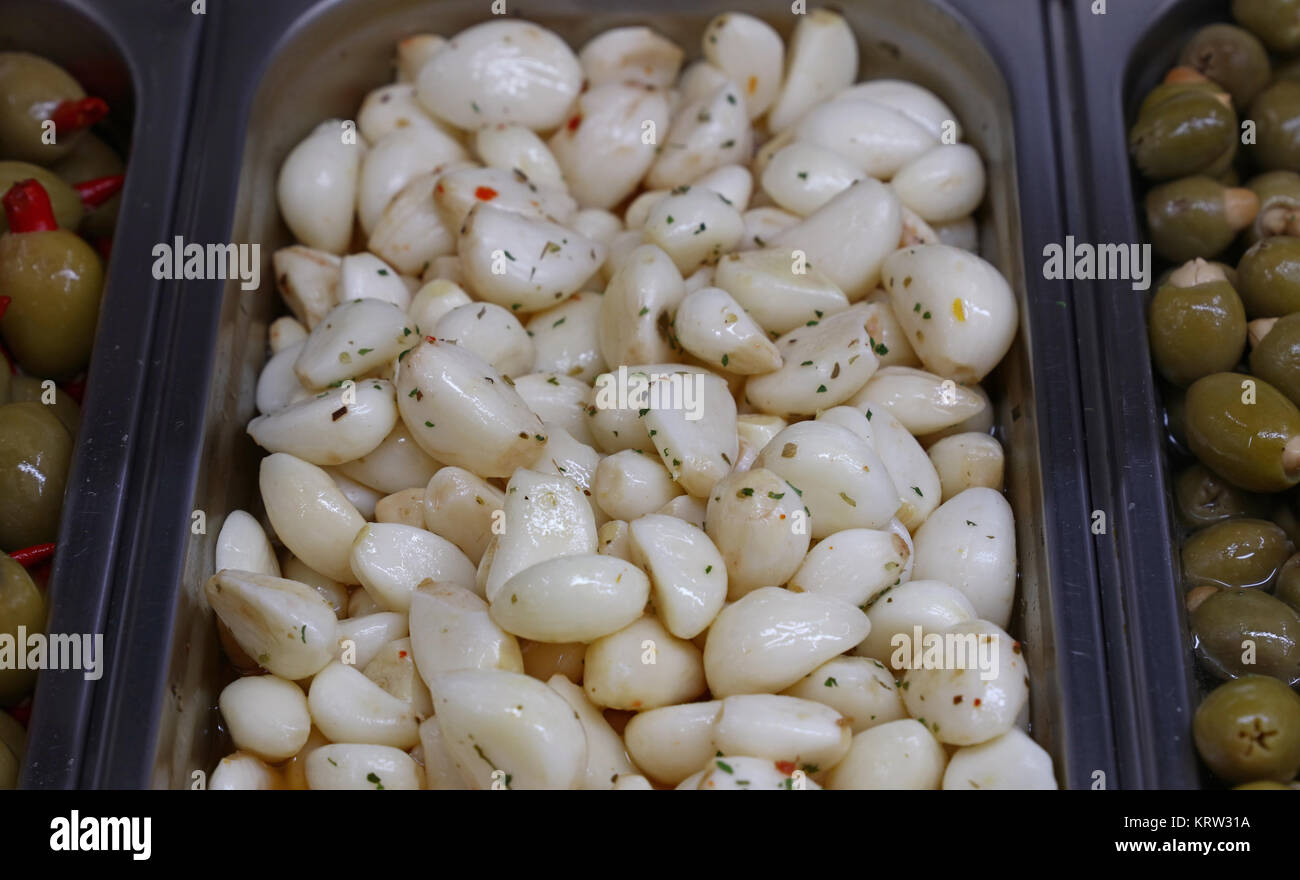 Pickled marinated garlic chives in retail tray Stock Photo - Alamy