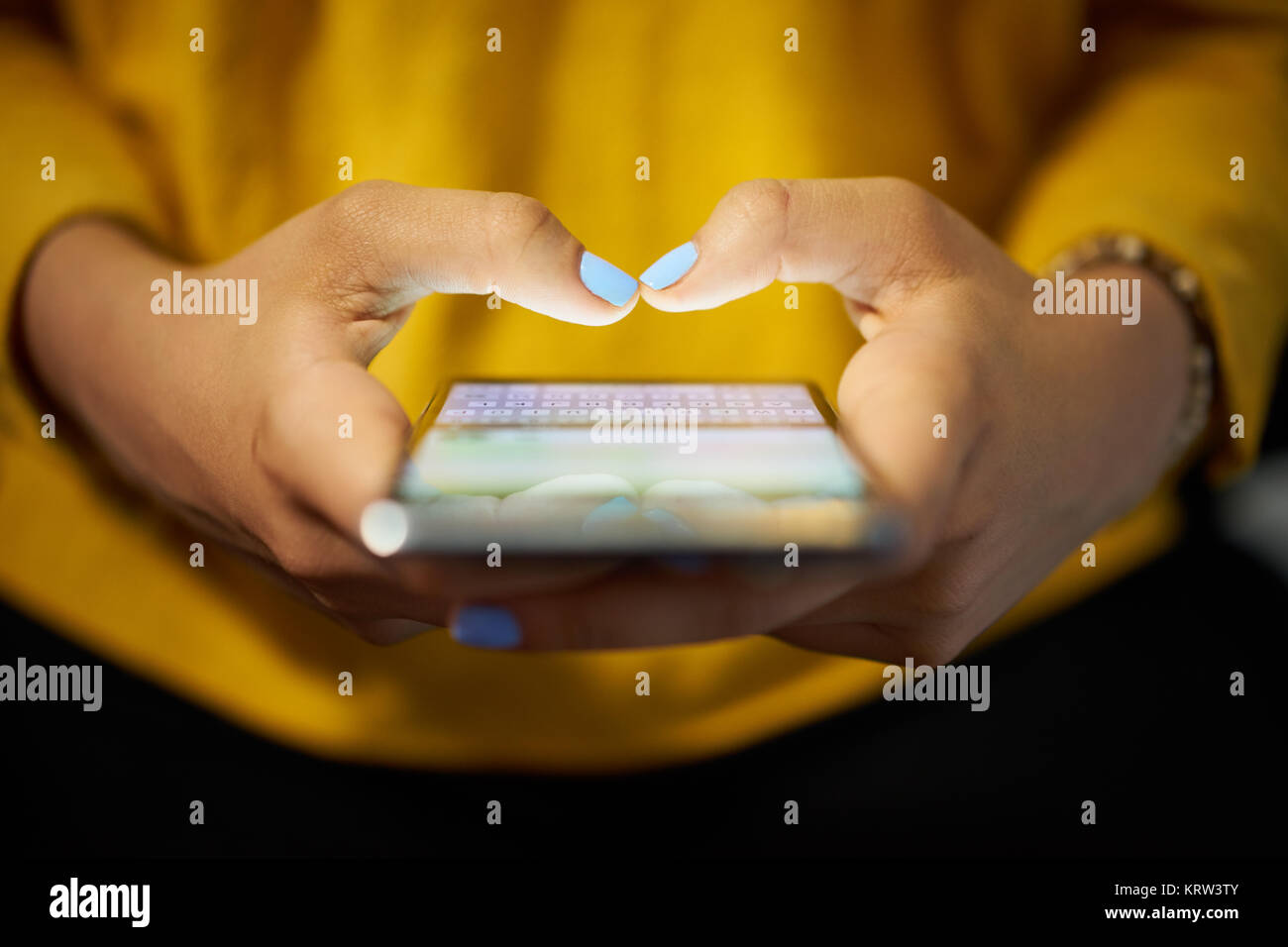 Woman Typing Phone Message On Social Network At Night Stock Photo - Alamy