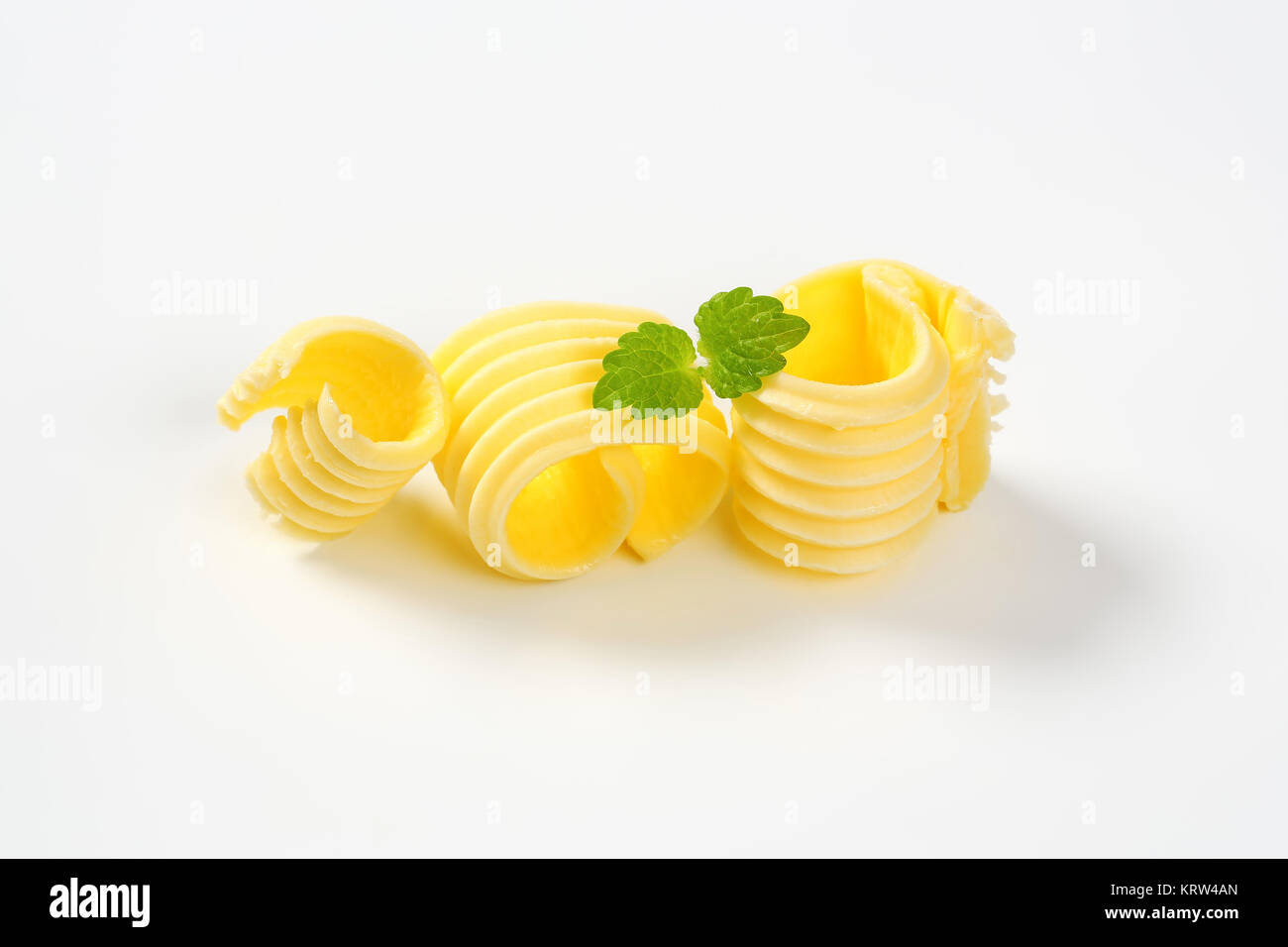 Three butter curls Stock Photo - Alamy