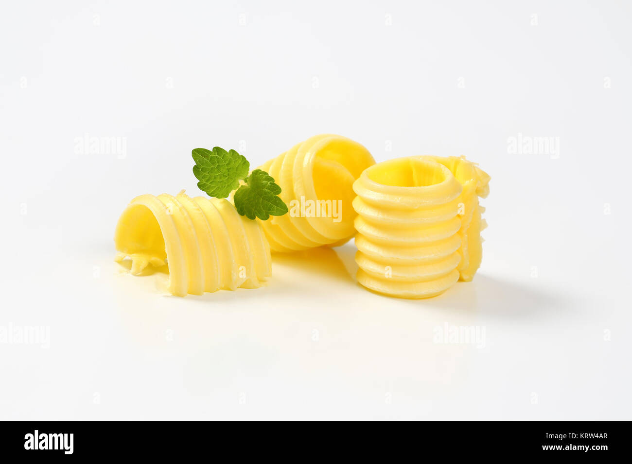 Three butter curls Stock Photo - Alamy