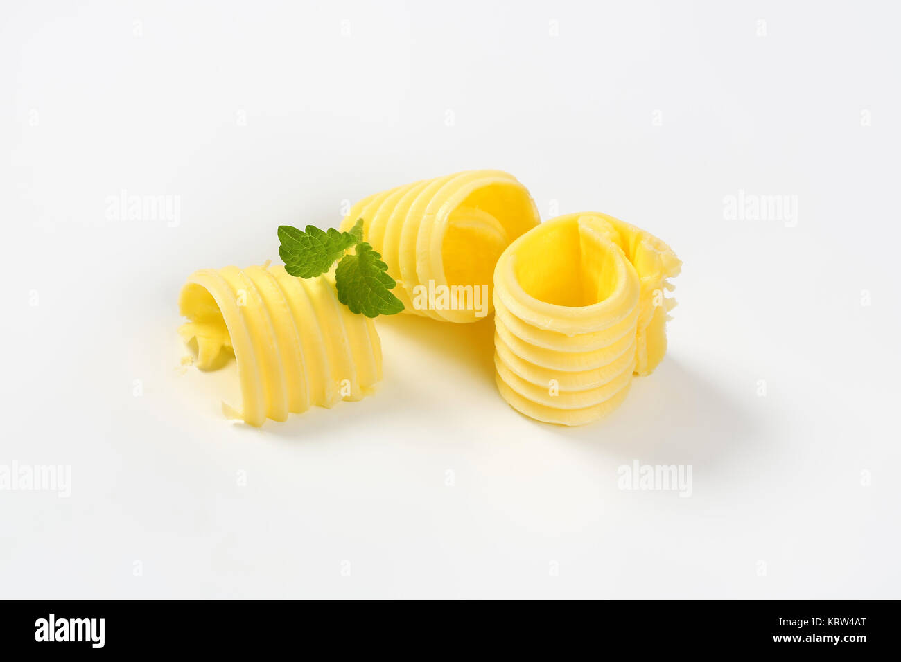 Three butter curls Stock Photo - Alamy