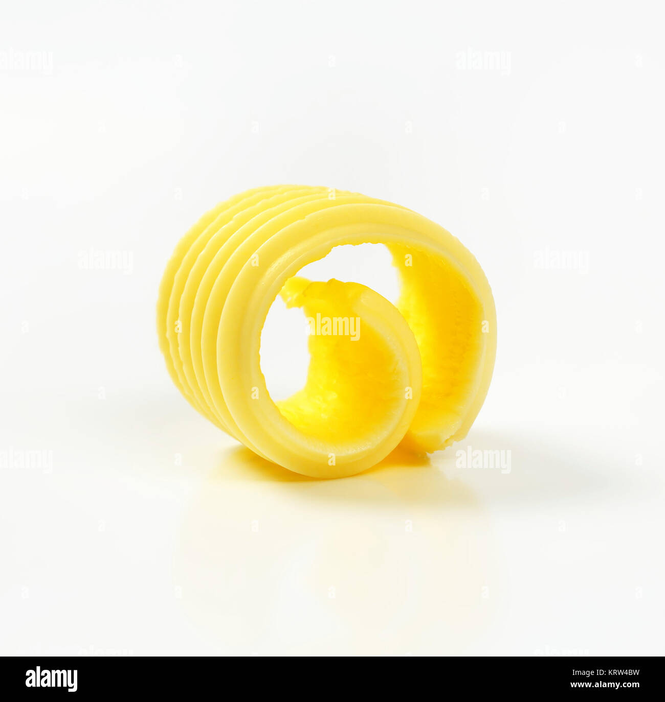 Single butter curl Stock Photo - Alamy