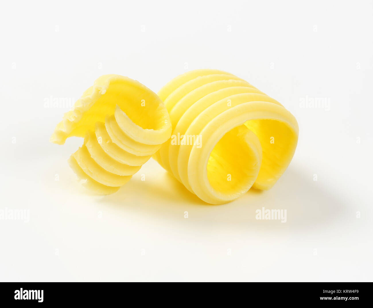 Two butter curls Stock Photo - Alamy