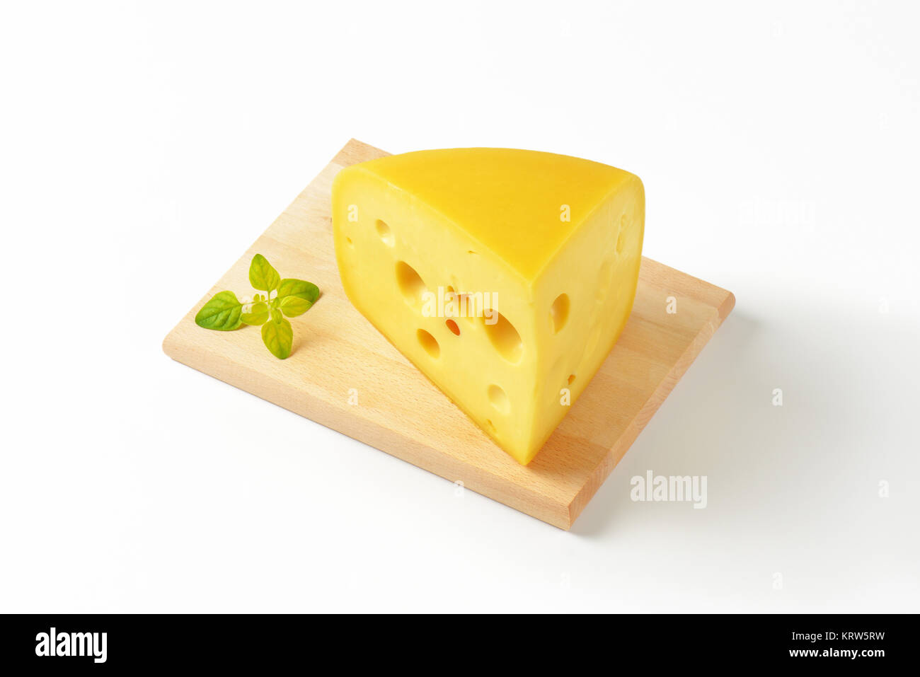 wedge of Swiss cheese Stock Photo - Alamy