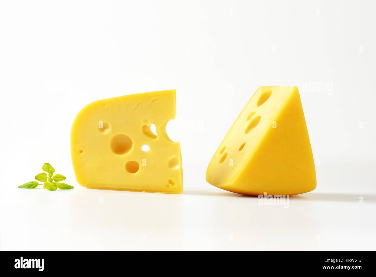 wedges of yellow cheese with eyes Stock Photo - Alamy