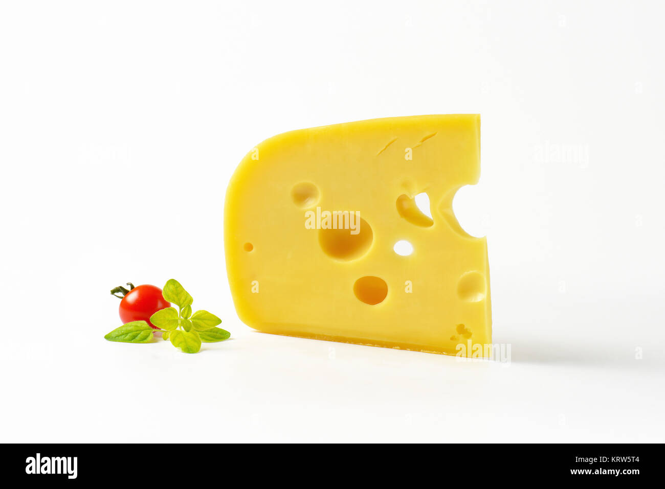 wedge of yellow cheese with eyes Stock Photo - Alamy