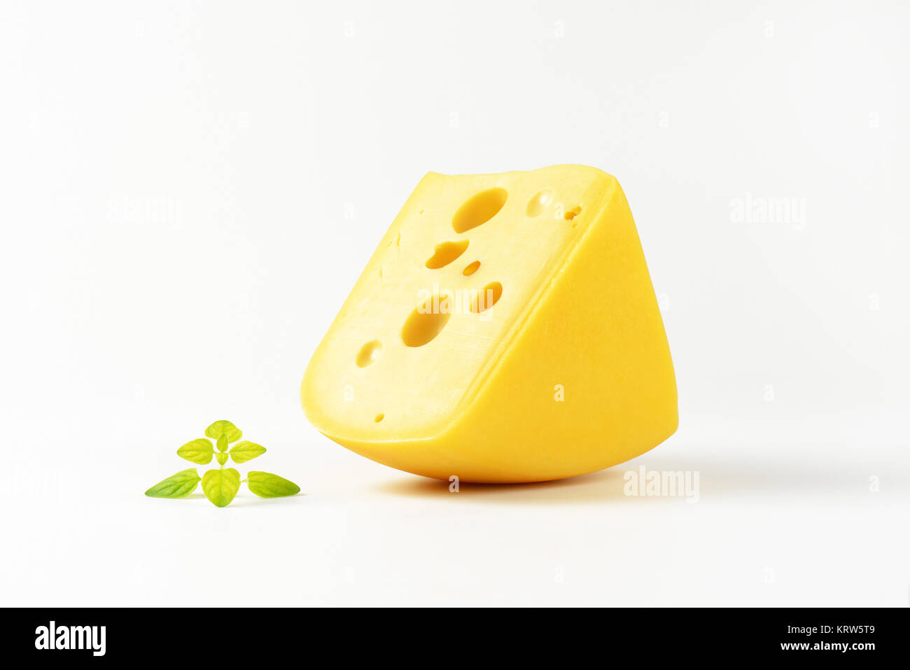 wedge of Swiss cheese Stock Photo - Alamy