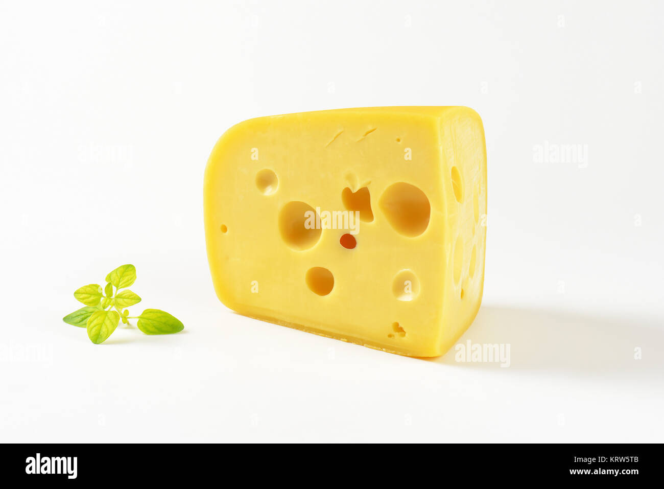 wedge of Swiss cheese Stock Photo - Alamy