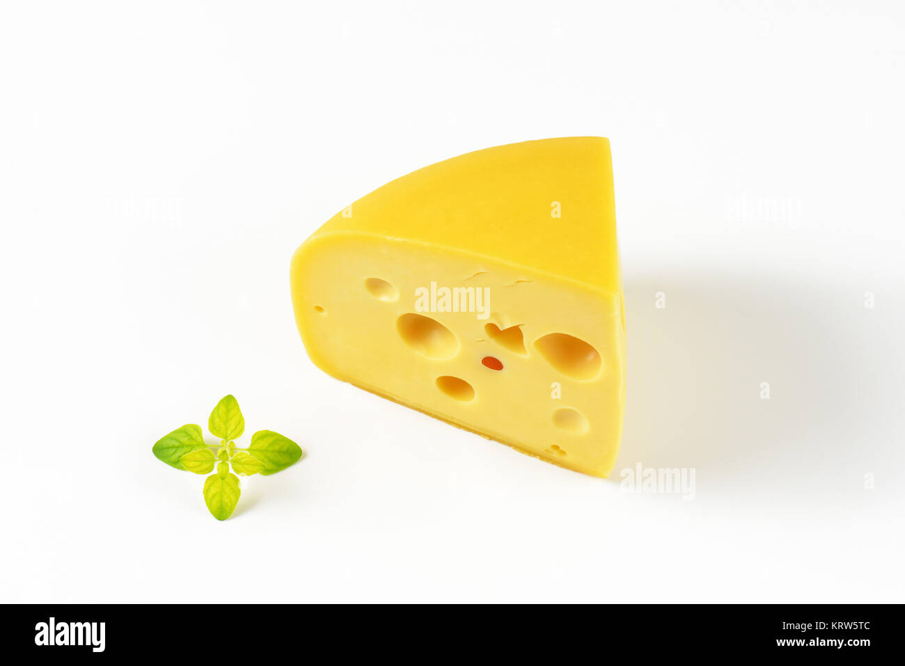wedge of Swiss cheese Stock Photo - Alamy
