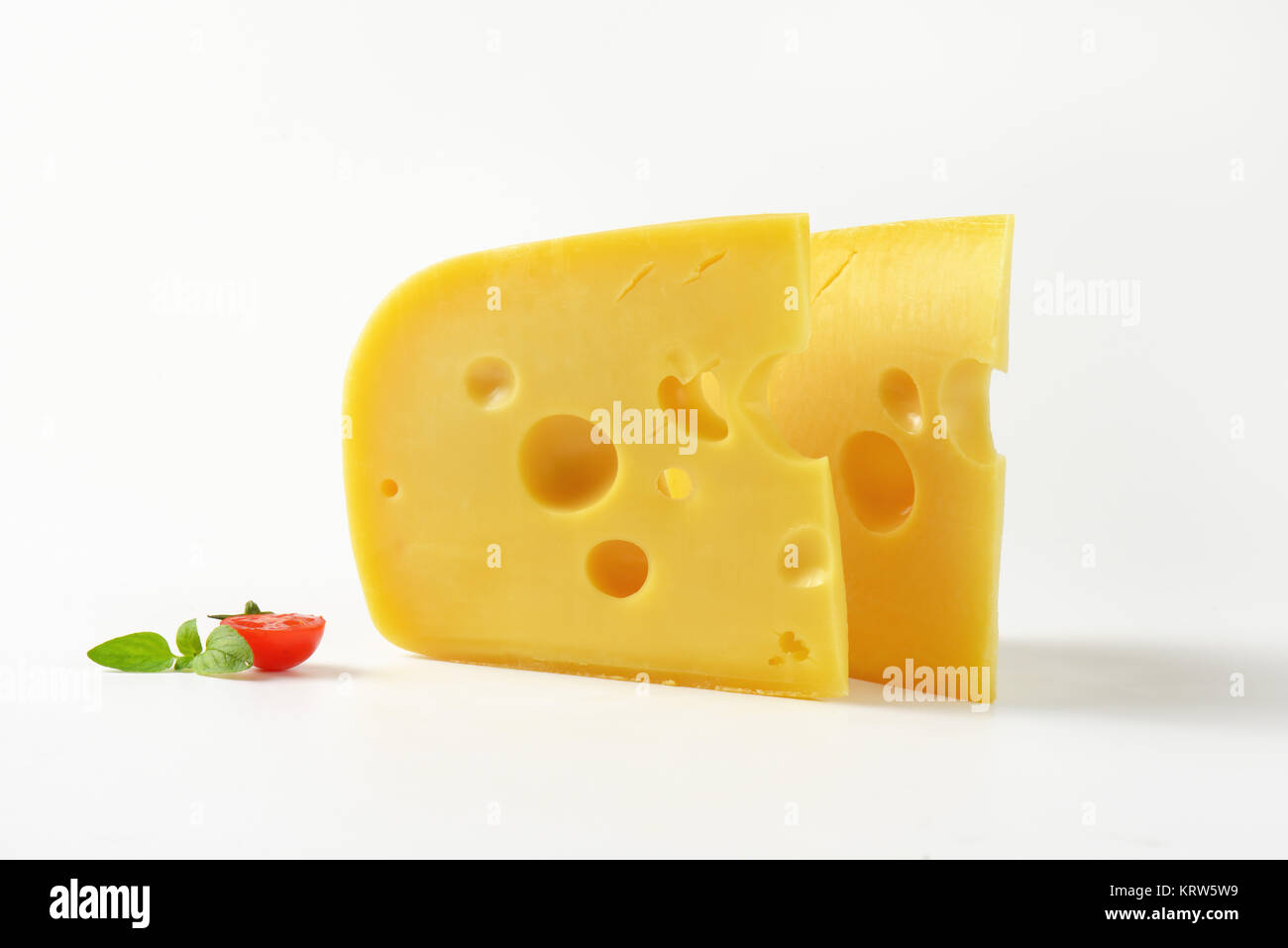 wedges of yellow cheese with eyes Stock Photo - Alamy