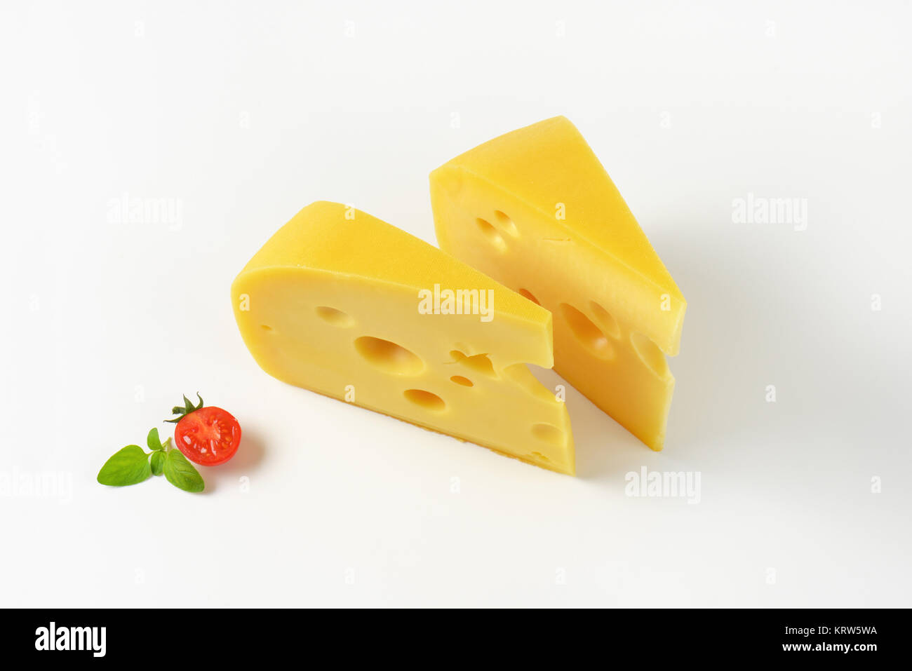 wedges of yellow cheese with eyes Stock Photo - Alamy