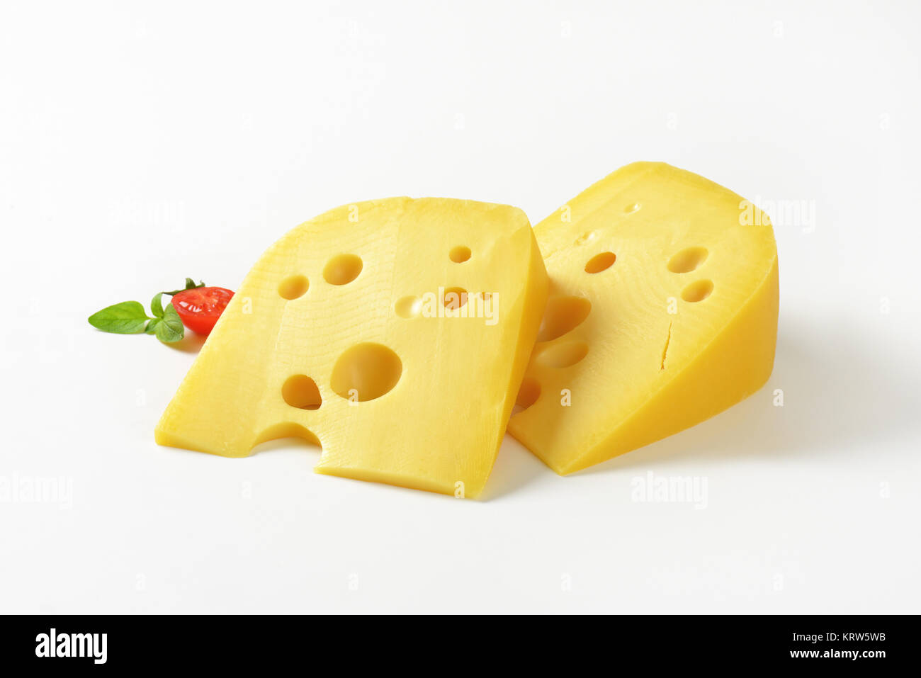 wedges of yellow cheese with eyes Stock Photo - Alamy