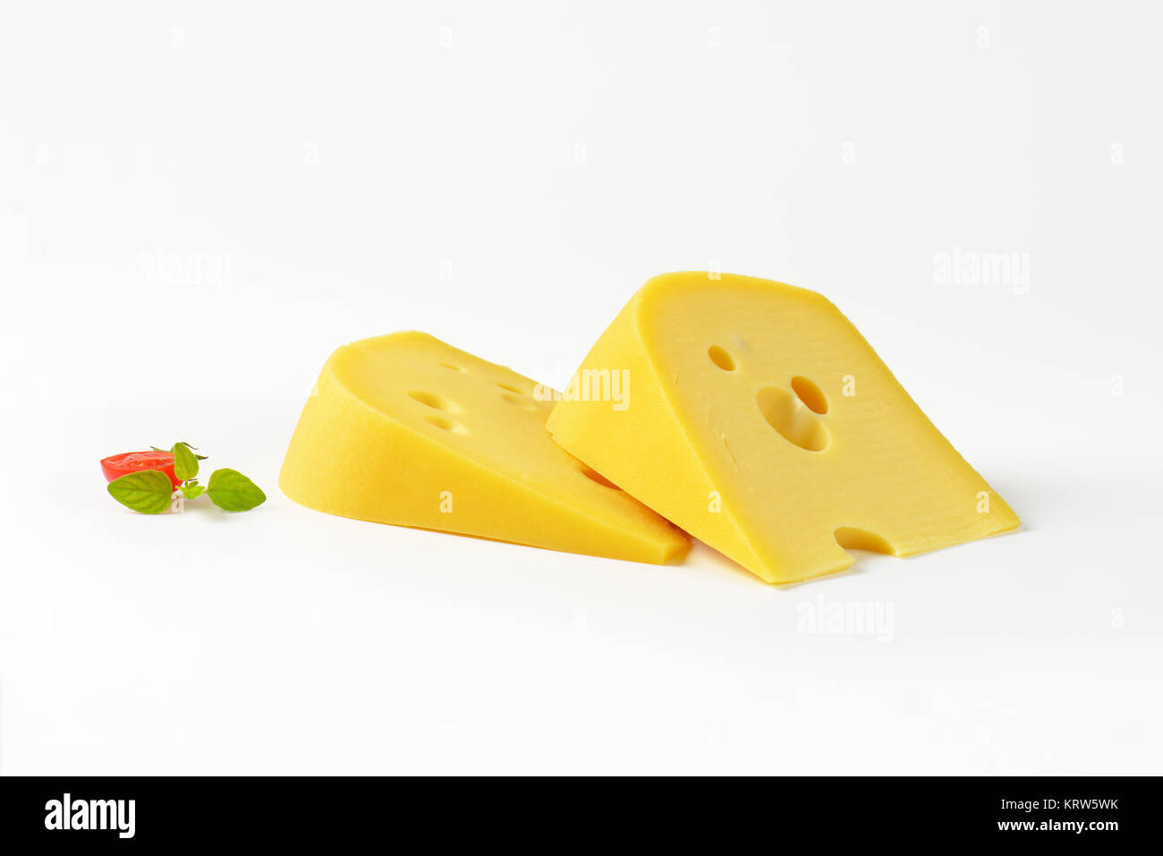 wedges of yellow cheese with eyes Stock Photo - Alamy