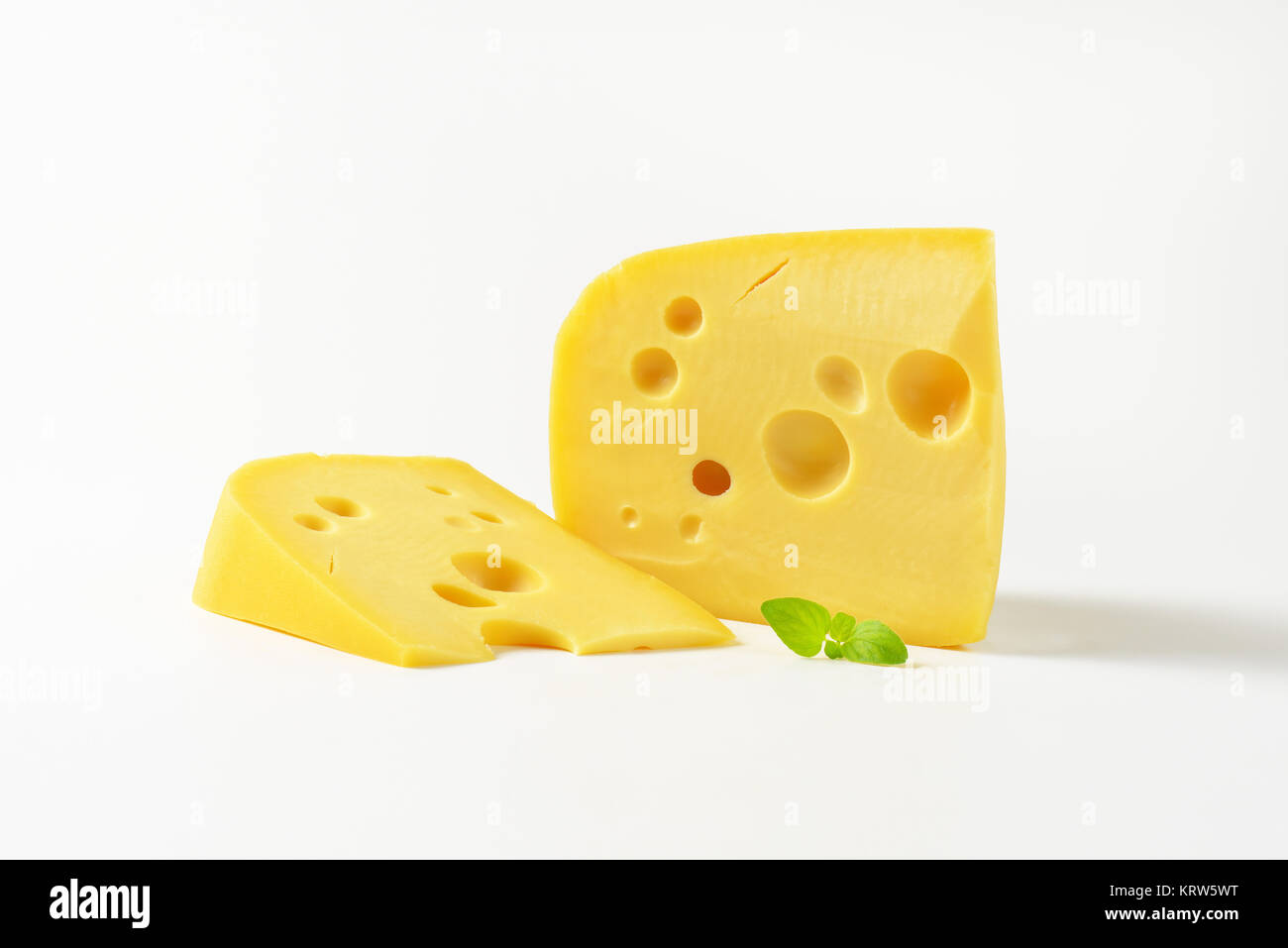 wedges of yellow cheese with eyes Stock Photo - Alamy