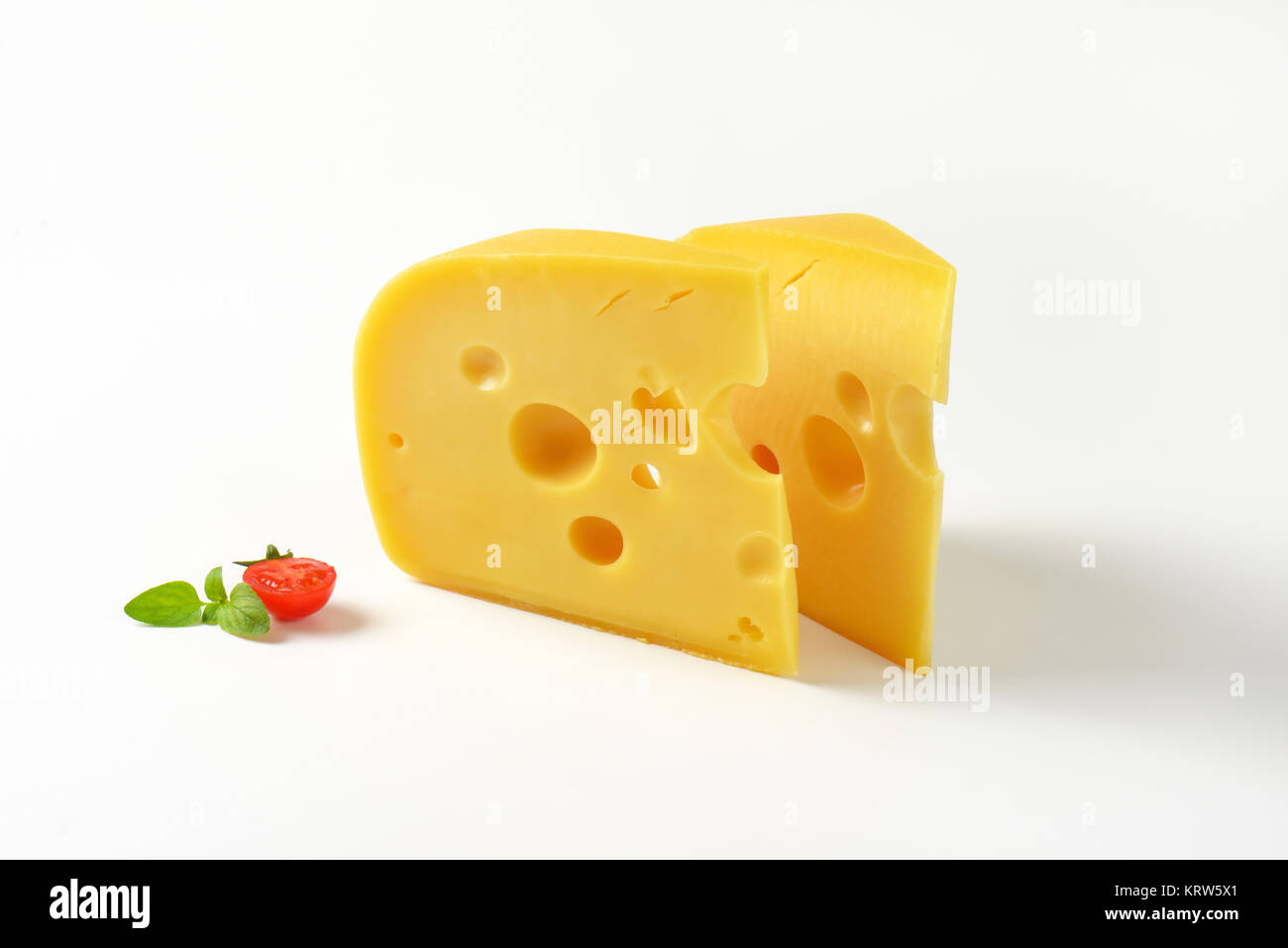 wedges of yellow cheese with eyes Stock Photo - Alamy