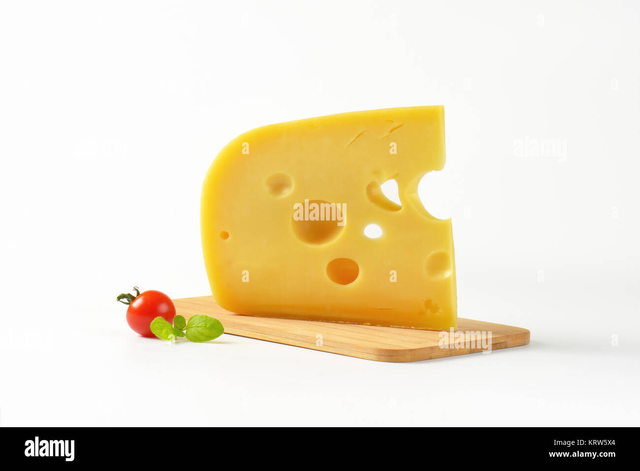 wedge of yellow cheese with eyes Stock Photo - Alamy