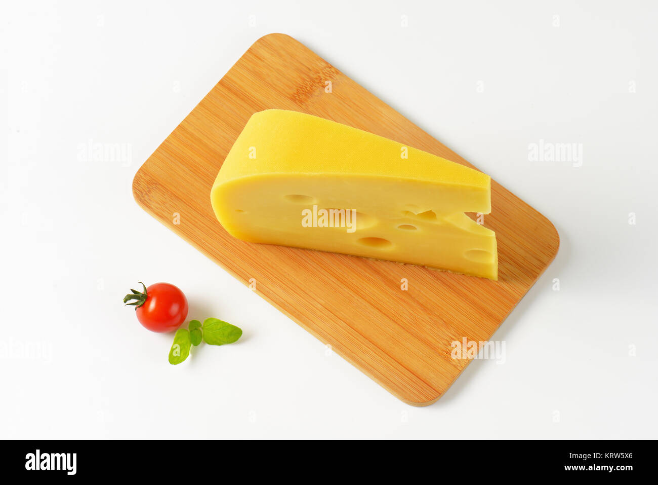 wedge of yellow cheese with eyes Stock Photo - Alamy
