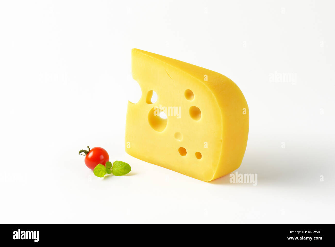 wedge of yellow cheese with eyes Stock Photo - Alamy