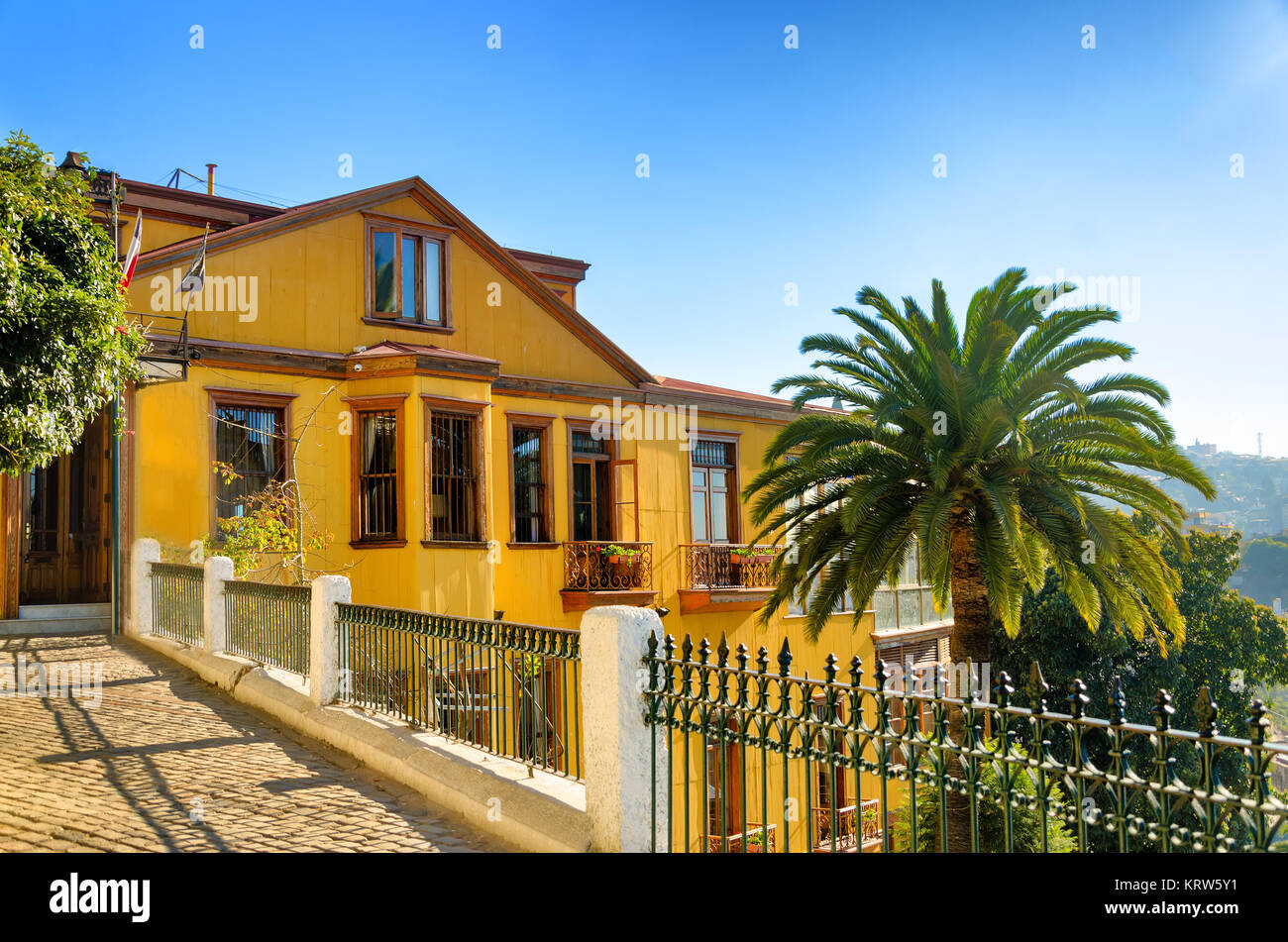Beautiful old yellow house on the hill Stock Photo - Alamy