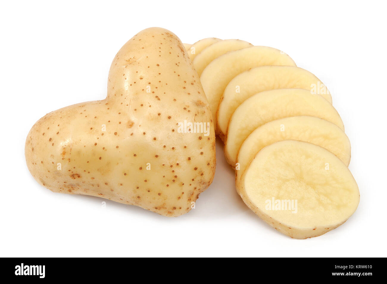 Heart shaped potato and slices Stock Photo - Alamy