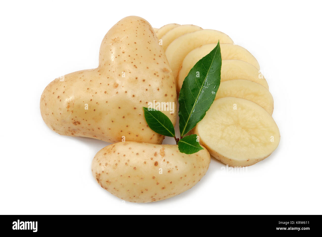Heart shaped potato and slices Stock Photo - Alamy