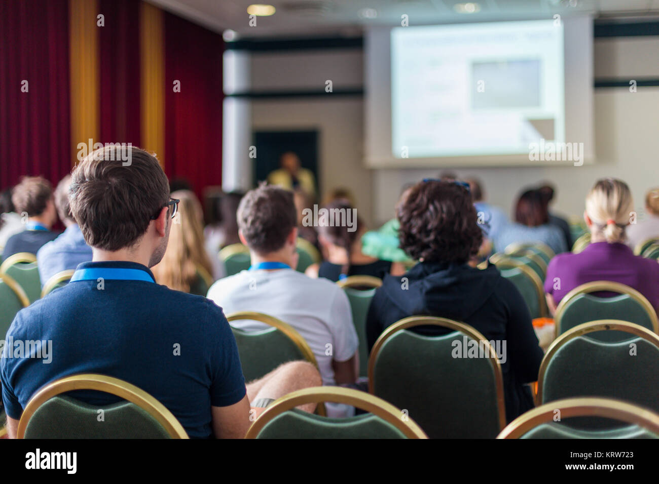 Audience in lecture hall participating at business conference Stock ...